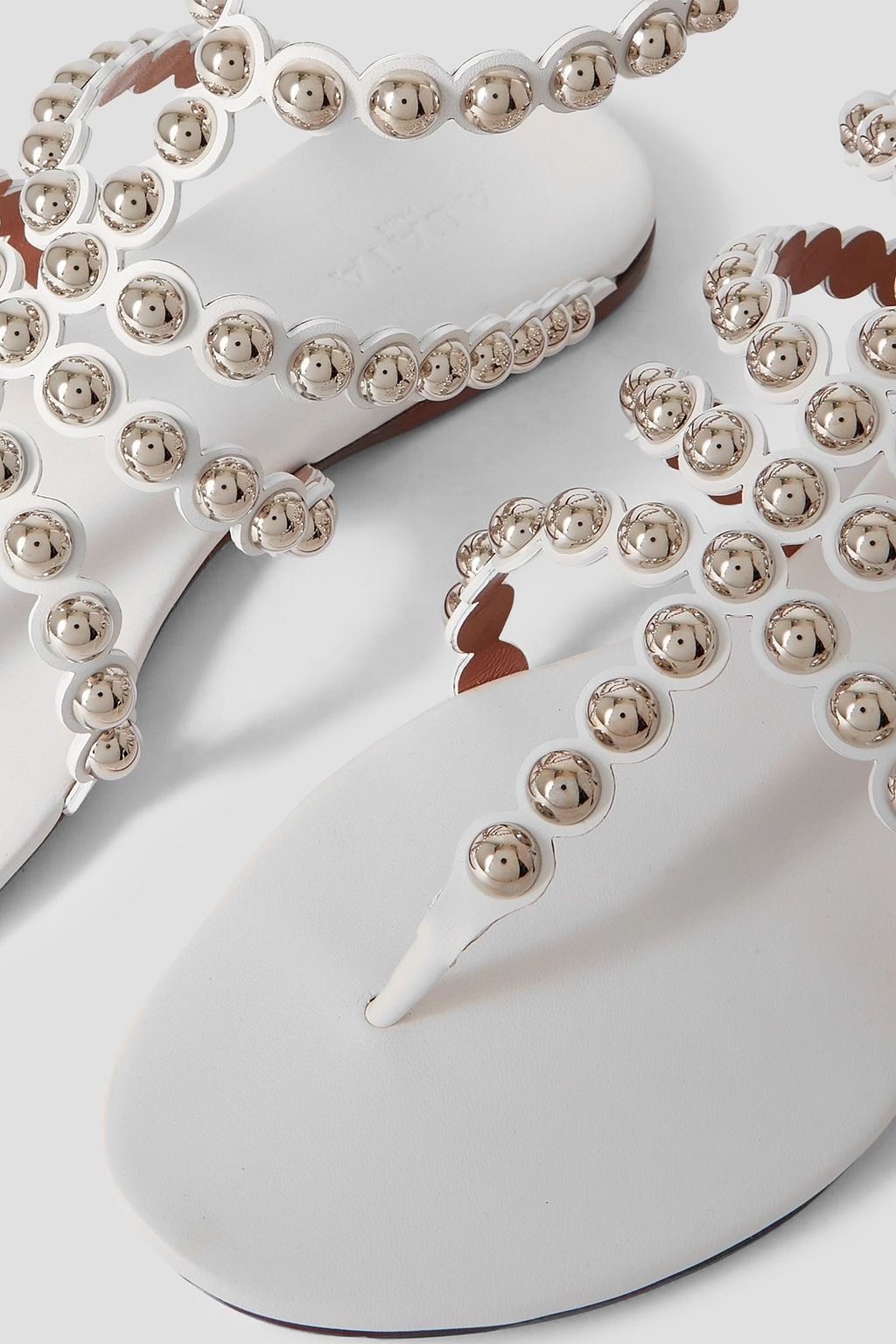 ALAÏA Studded laser-cut leather sandals | THE OUTNET