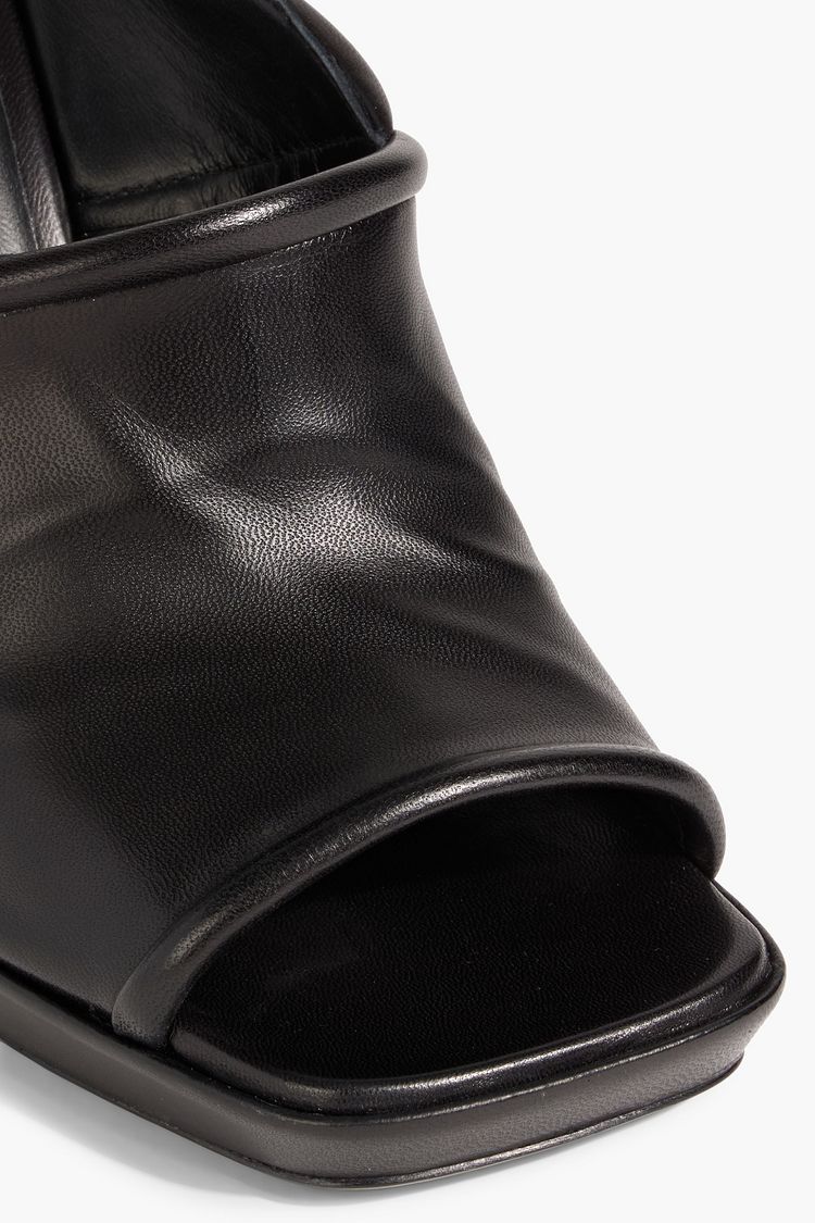 KHAITE Stagg leather wedge mules | THE OUTNET