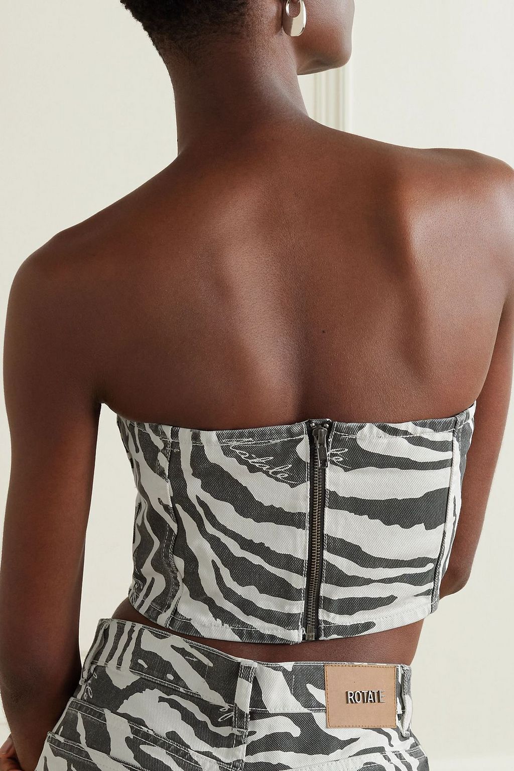 ROTATE BIRGER CHRISTENSEN Zebra-print strapless cropped organic denim ...